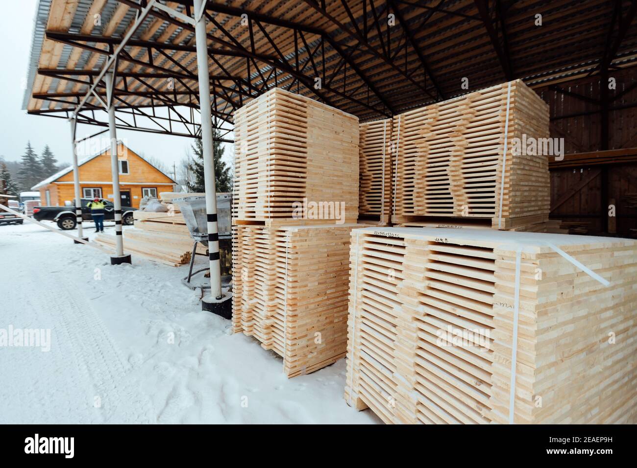 warehouse of wooden boards, background texture of wood harvested for ...