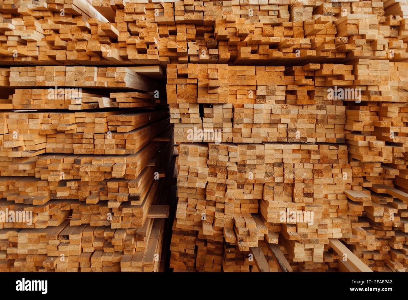 warehouse of wooden boards, background texture of wood harvested for ...