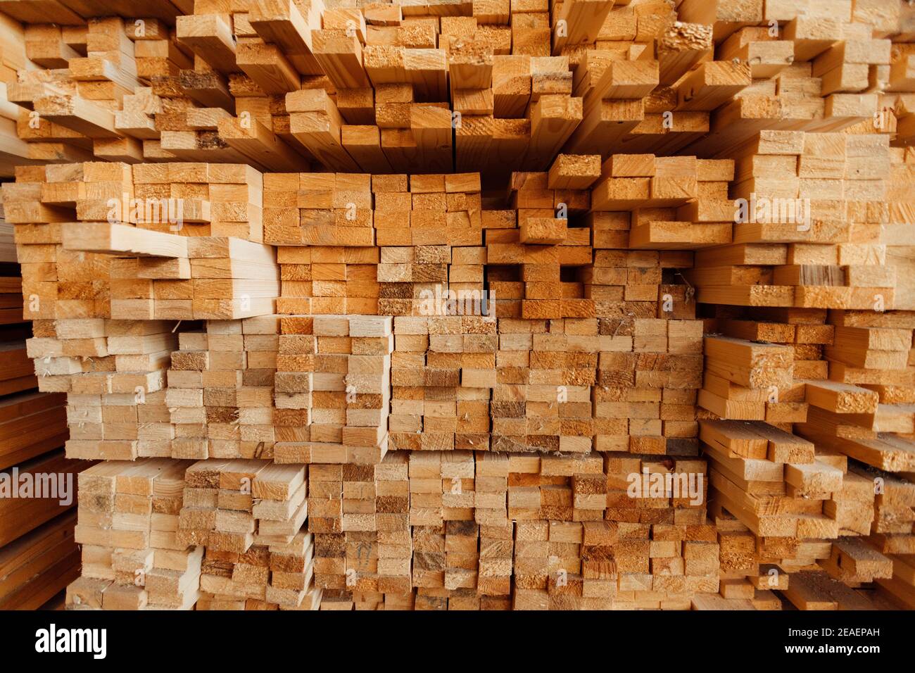 warehouse of wooden boards, background texture of wood harvested for ...
