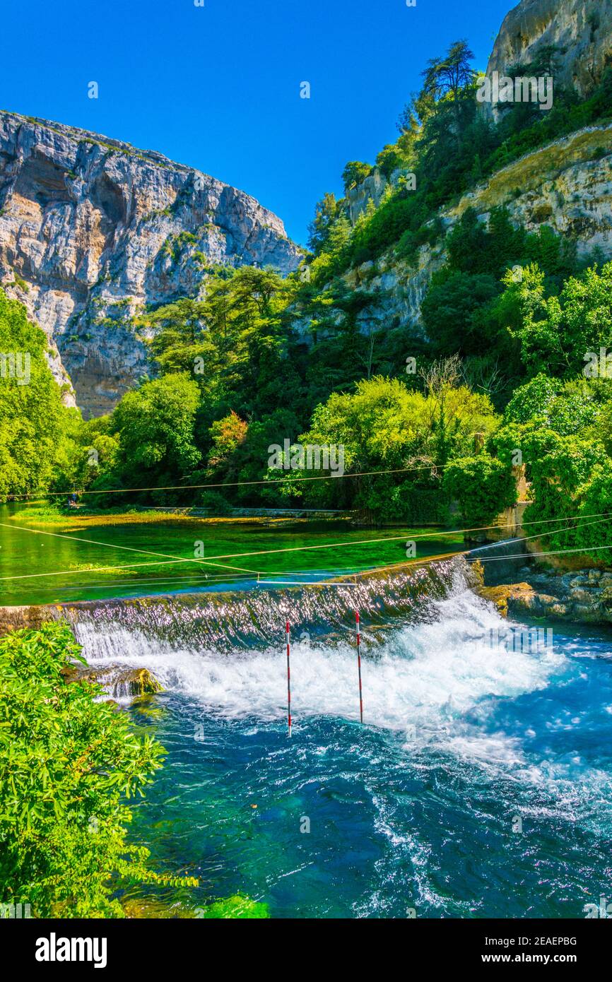 La sorgue river passing through Fontaine de Vaucluse village in France ...