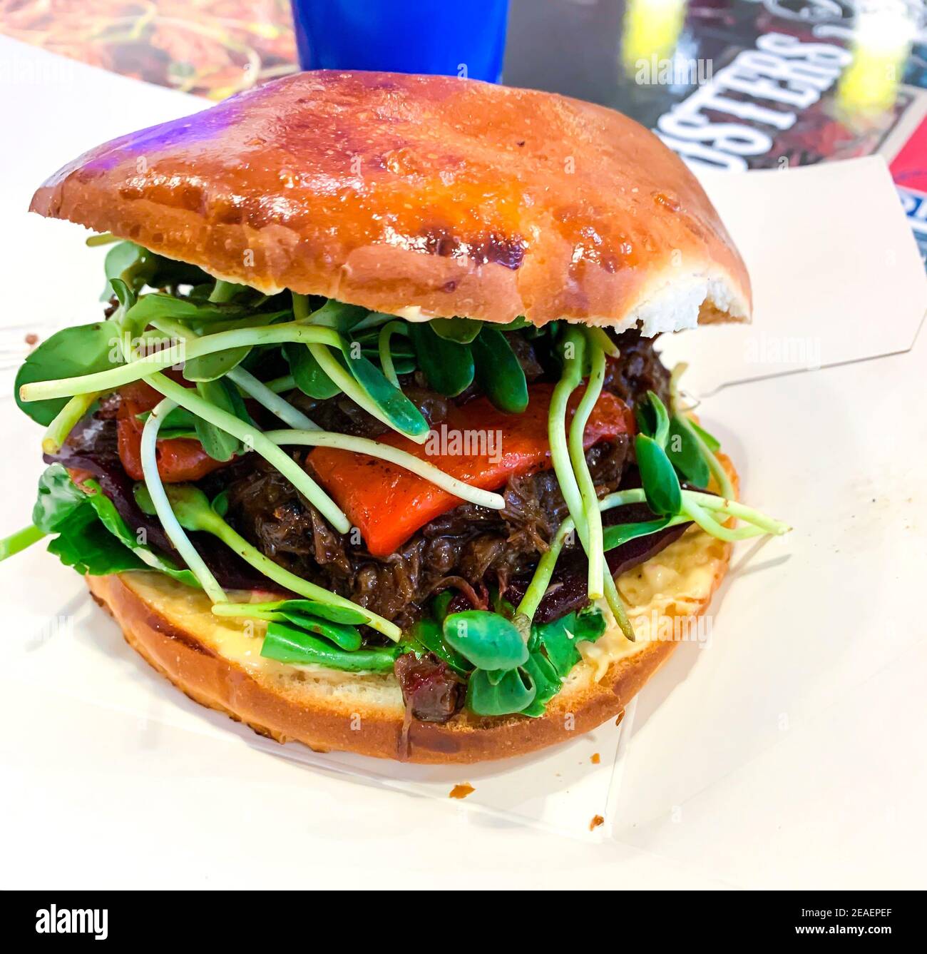 Burger with meat and green young sprouts Stock Photo - Alamy