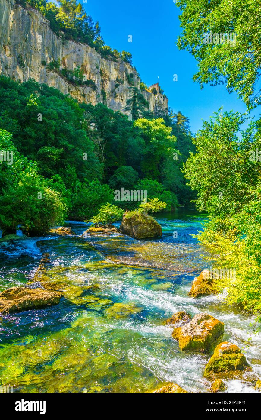 La sorgue river passing through Fontaine de Vaucluse village in France ...