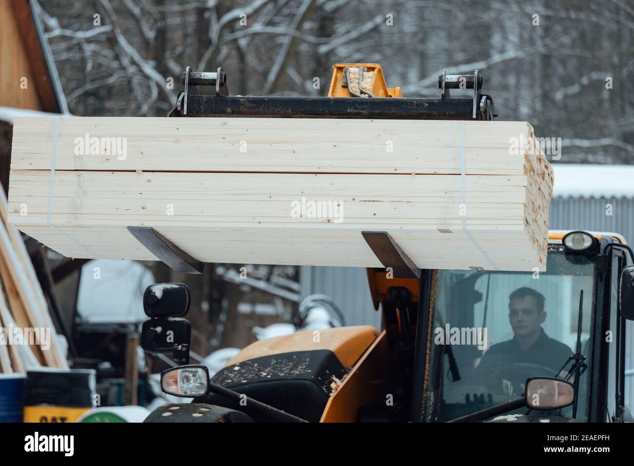 forklift truck with planks, delivery of wood to the warehouse, loading ...