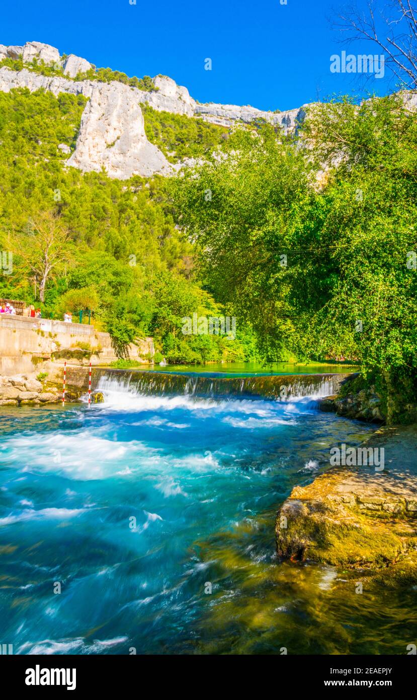 La sorgue river passing through Fontaine de Vaucluse village in France ...