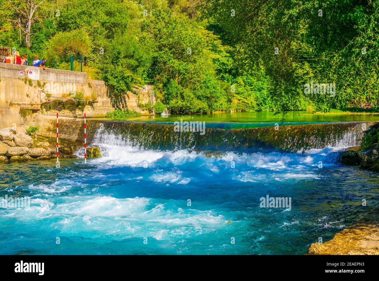 La sorgue river passing through Fontaine de Vaucluse village in France ...