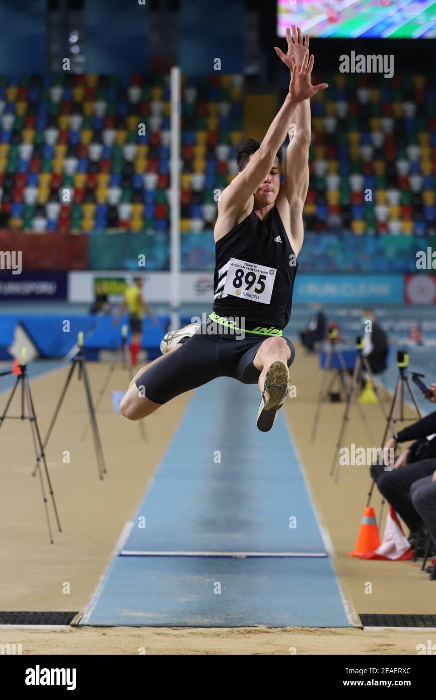 ISTANBUL, TURKEY - FEBRUARY 06, 2021: Undefined athlete long jumping ...