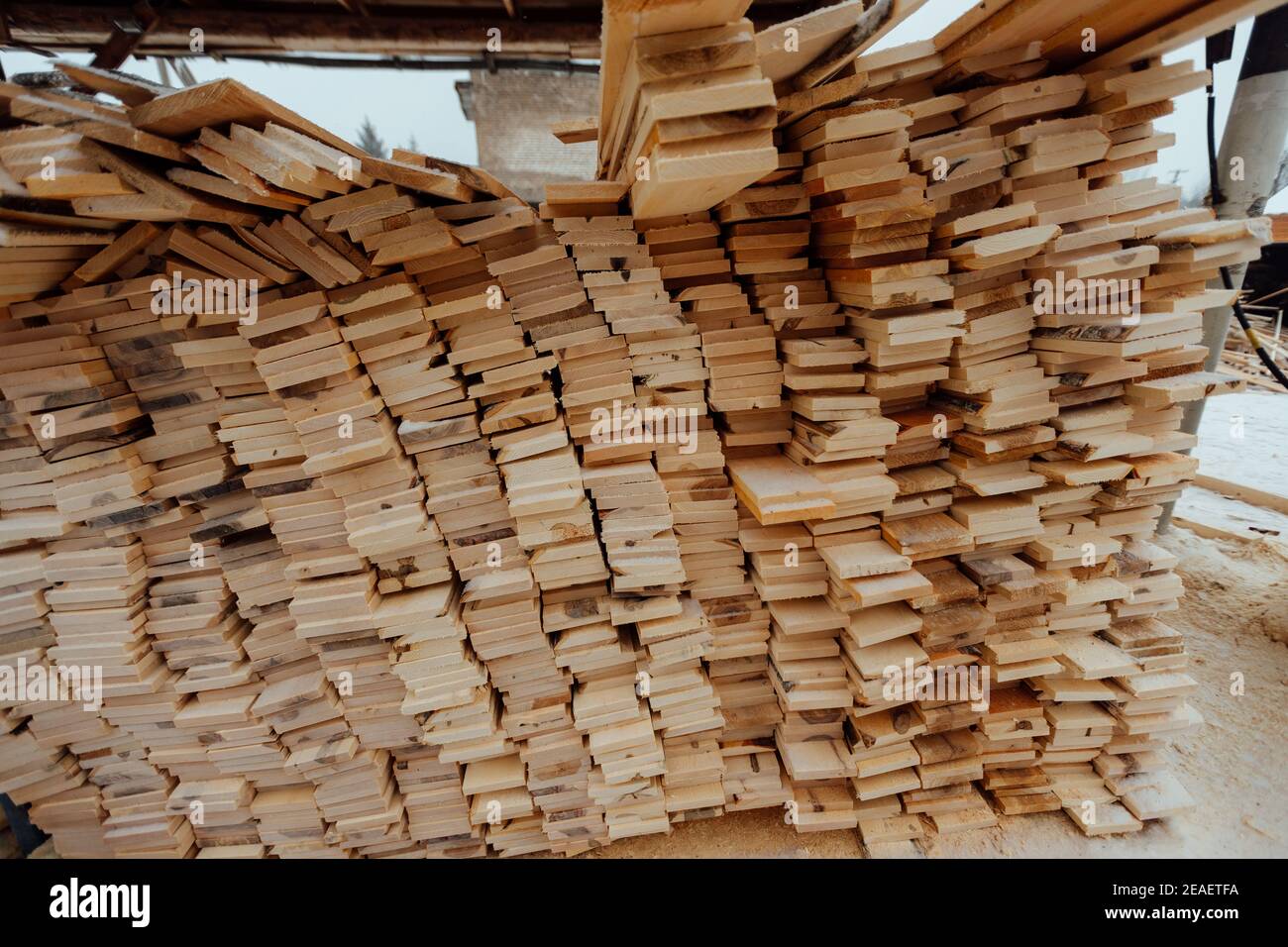 warehouse of wooden boards, background texture of wood harvested for ...