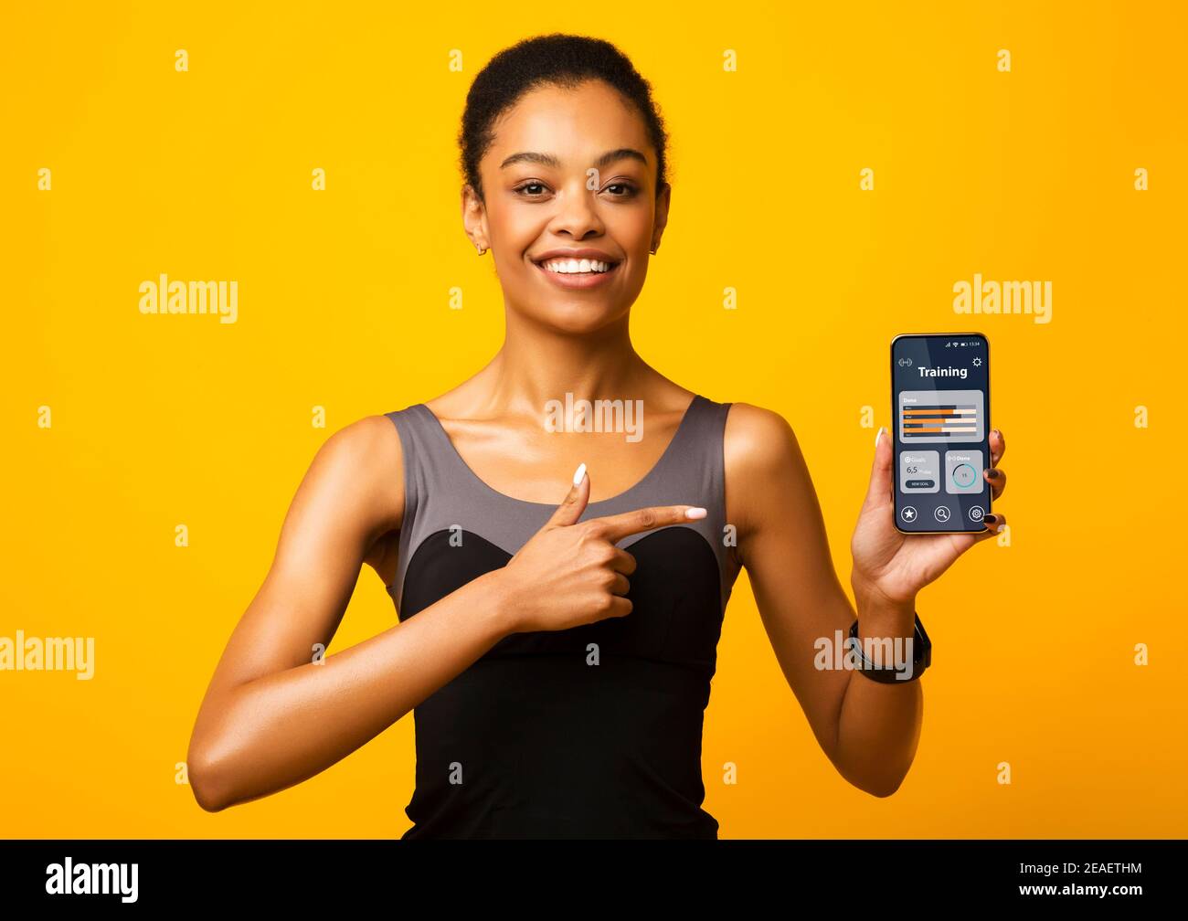 Training App. Fit African Woman Showing Smartphone With Modern Fitness ...