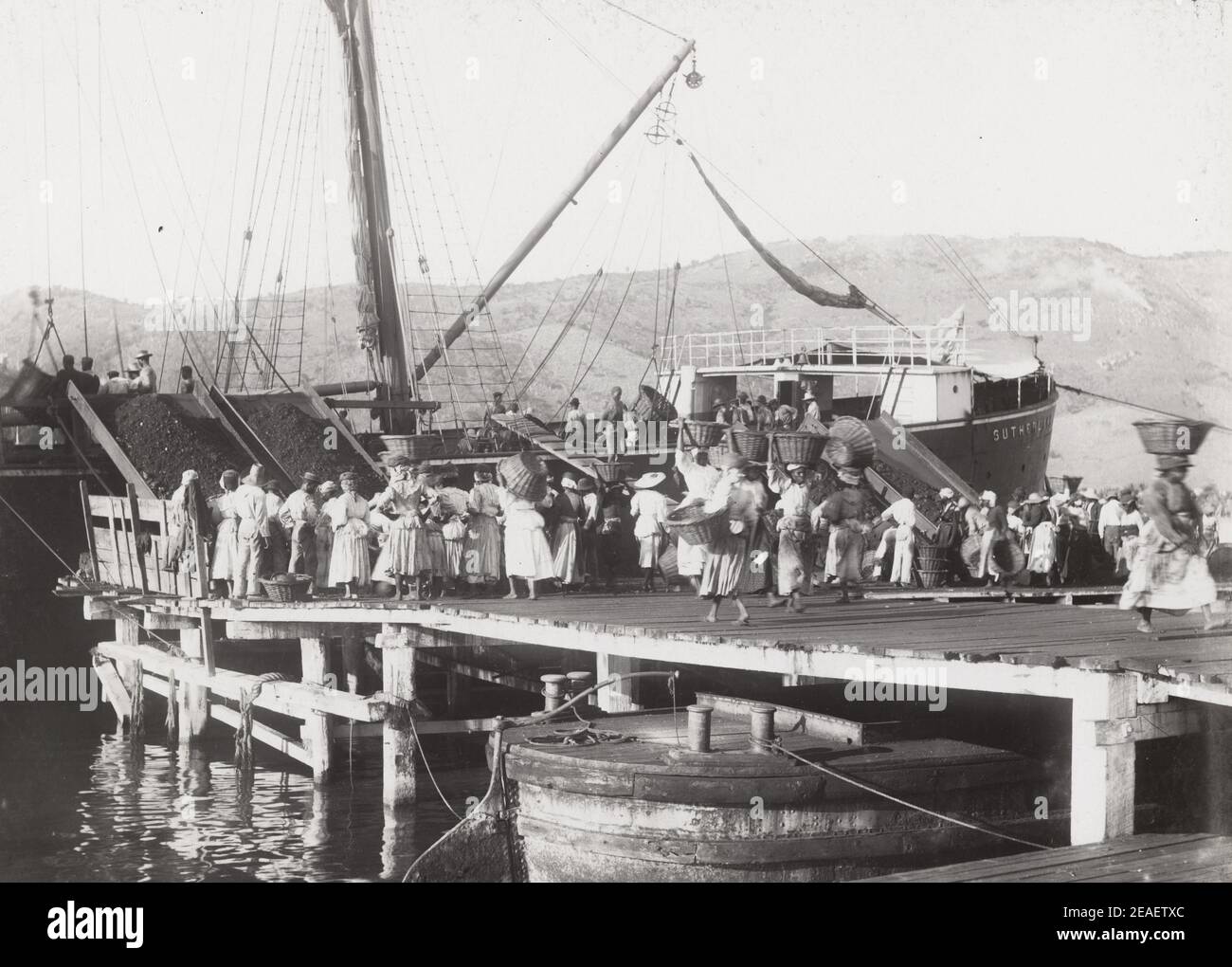 c.1900 vintage photograph, West Indies: loading a steam ship with coal ...