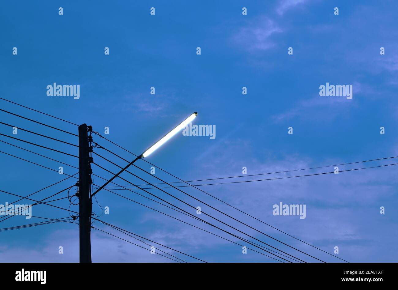 electric fluorescent lamp post on street in twilight sky Stock Photo ...