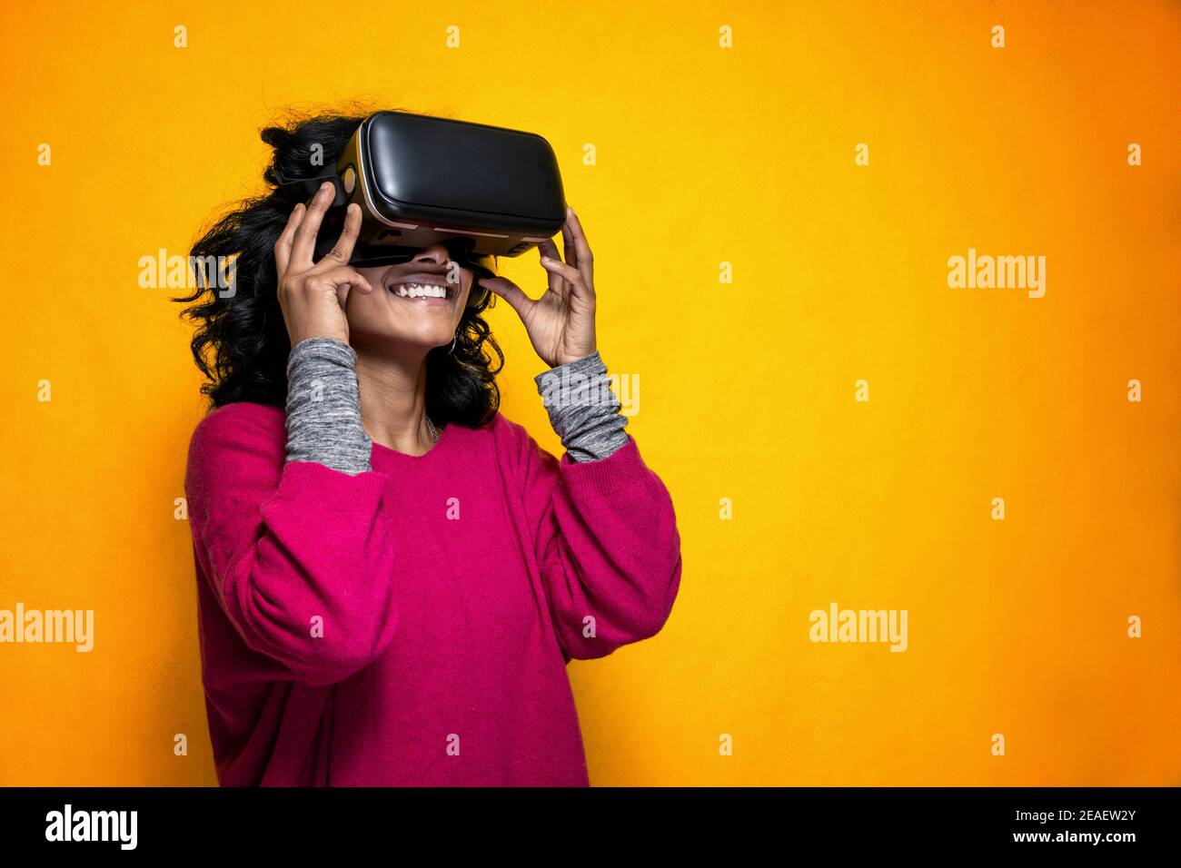 Beautiful young indian woman uses Vr glassess for augmented reality ...