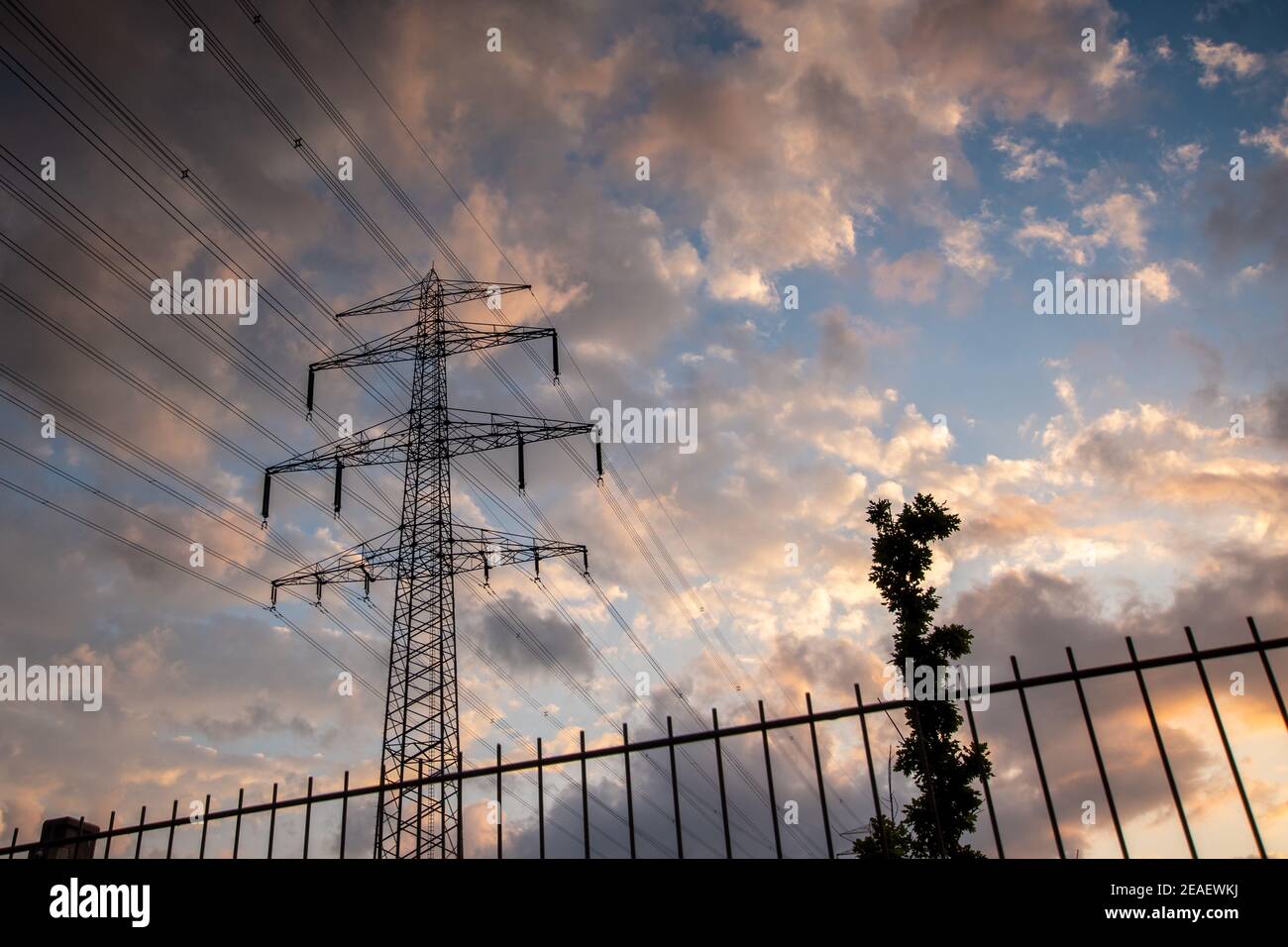 Power transmission tower against the sunset sky Stock Photo - Alamy