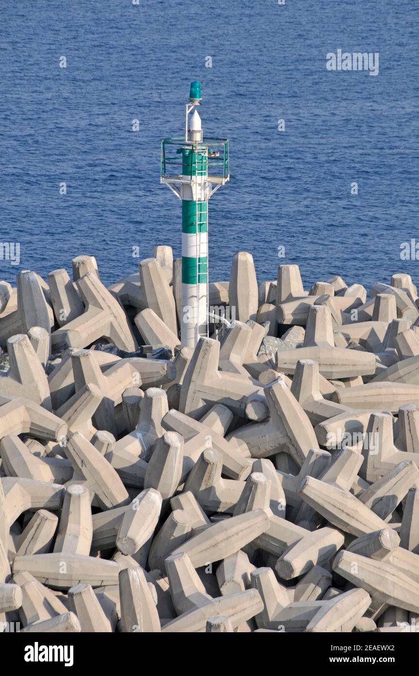 Dolosse type heavy precast concrete blocks in large heap as breakwater ...