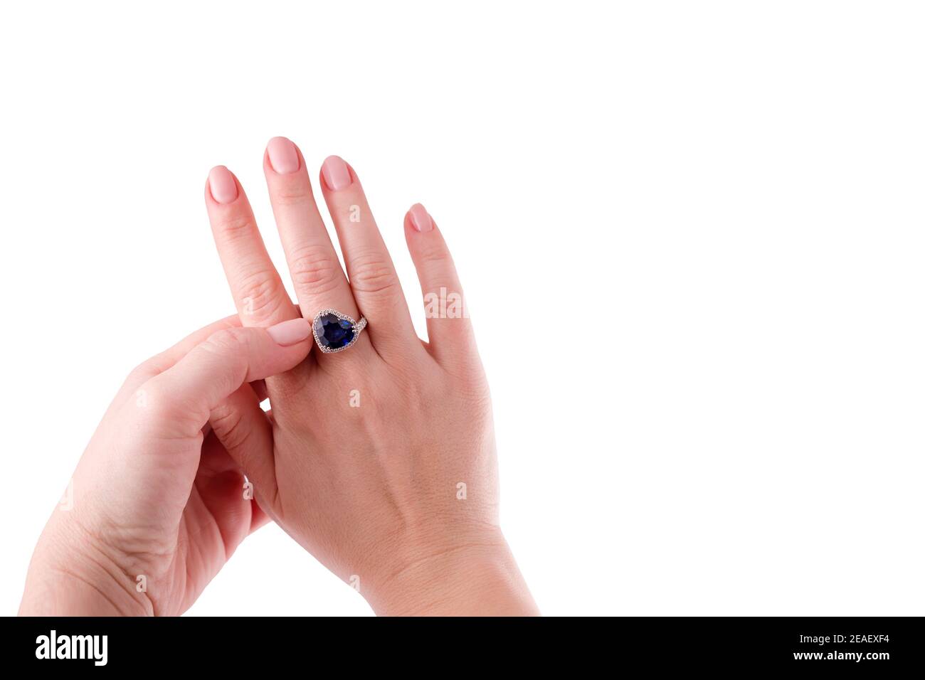 Heart shaped blue sapphire precious ring on woman hand isolated on ...