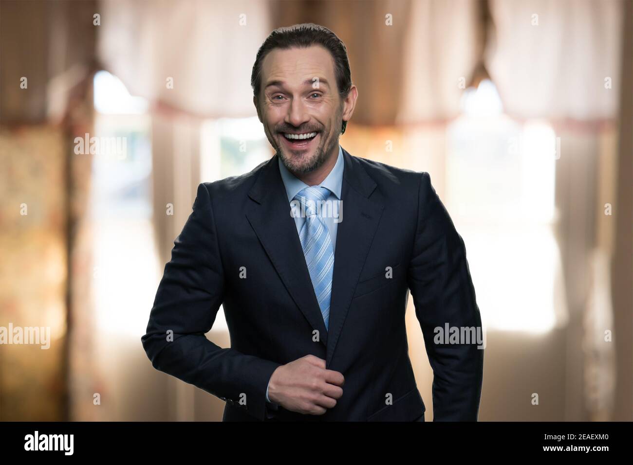 Portrait of laughing businessman Stock Photo - Alamy