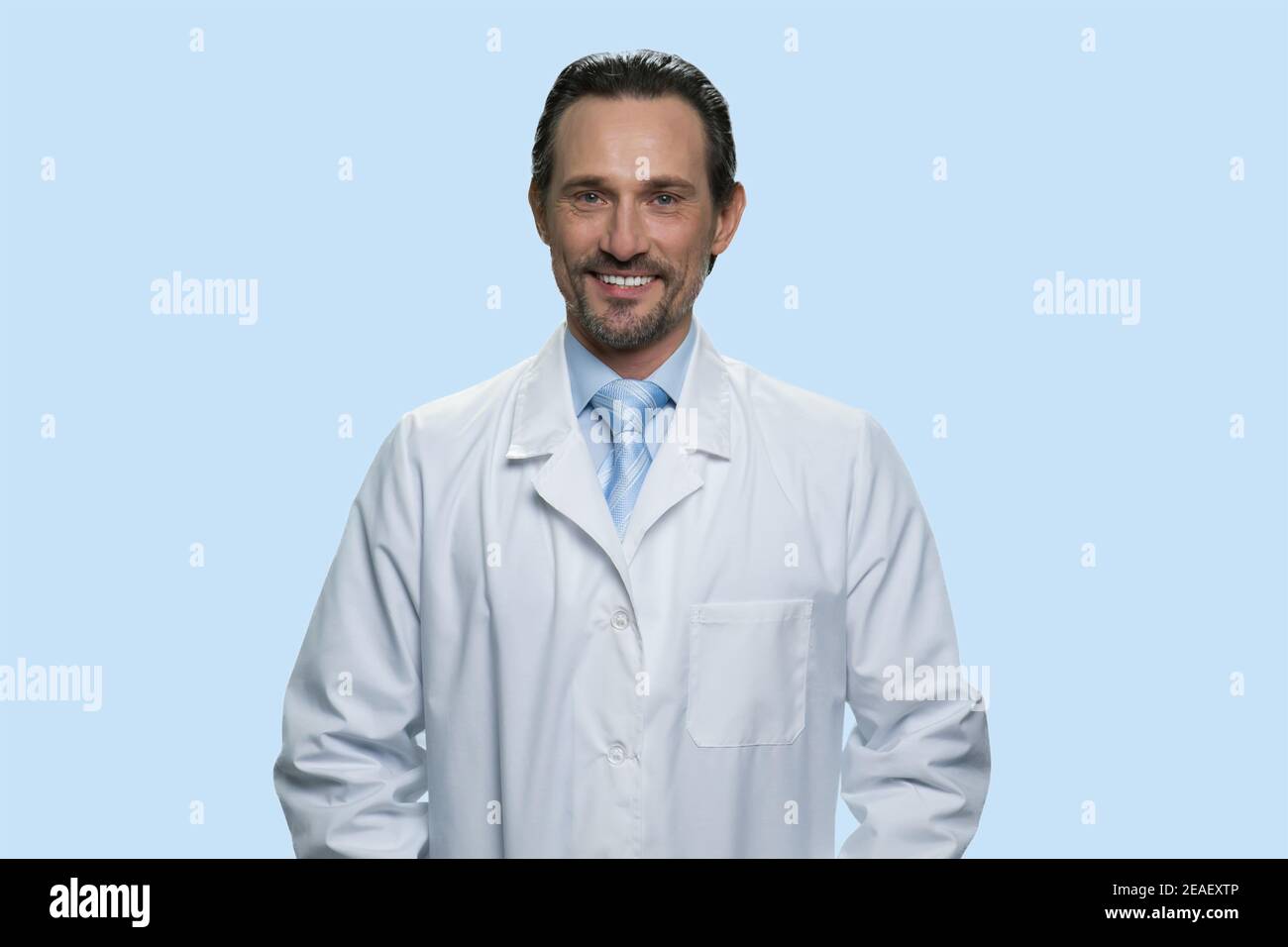 Positive man in white coat hi-res stock photography and images - Alamy