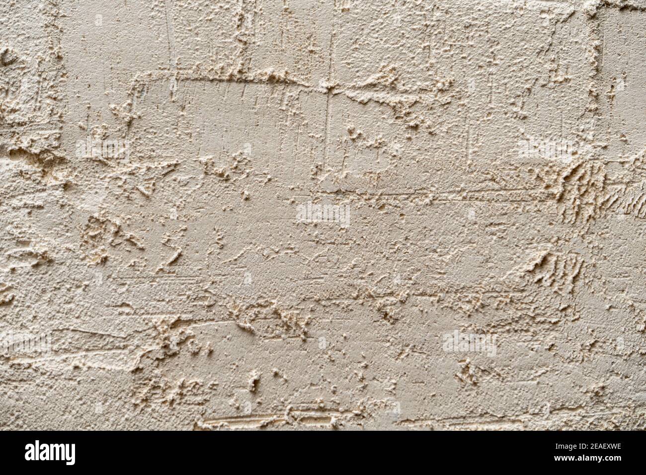 white textured plaster on the wall. Background for texture and design ...