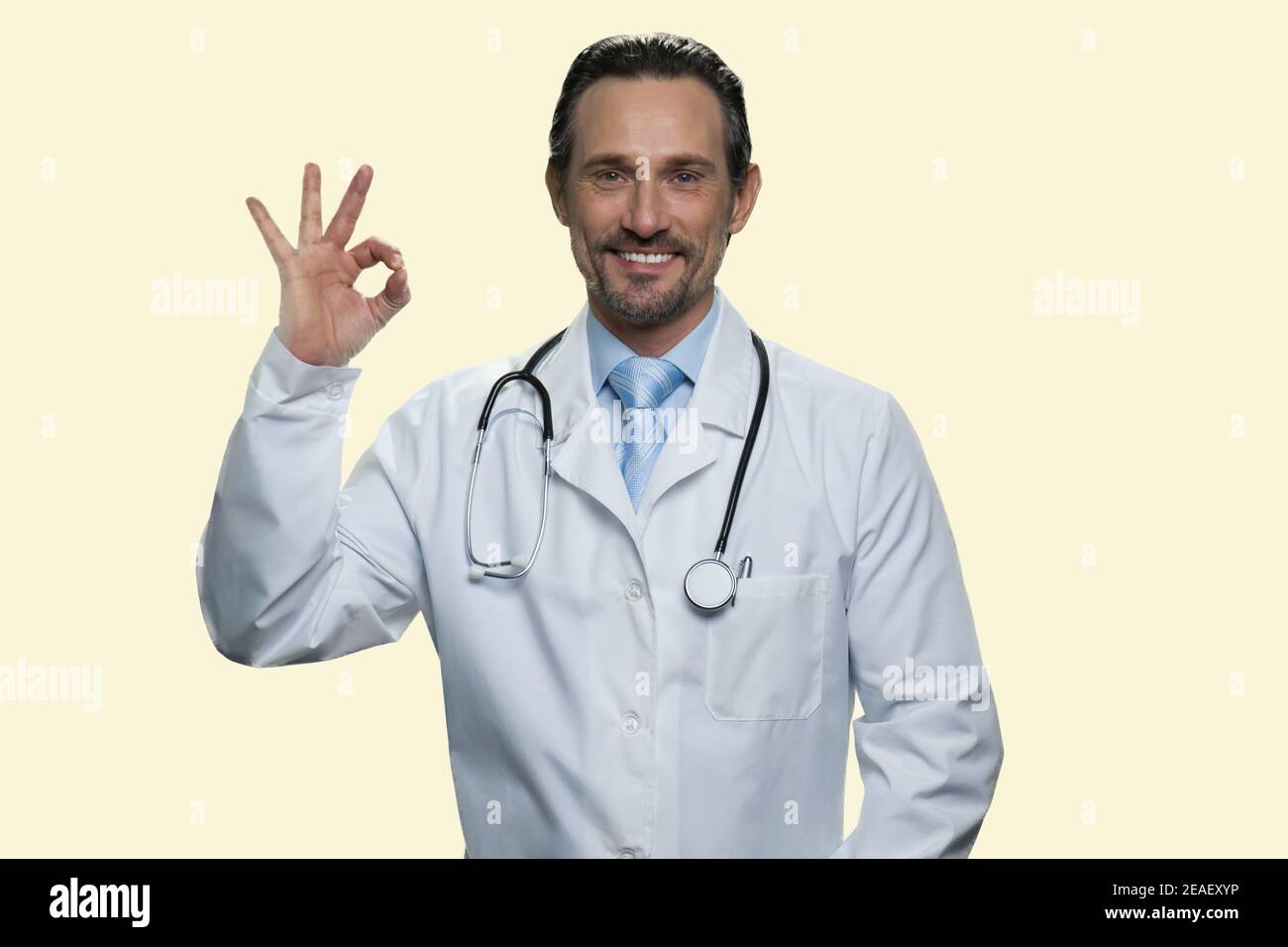Doctor with stethoscope is showing ok gesture Stock Photo - Alamy
