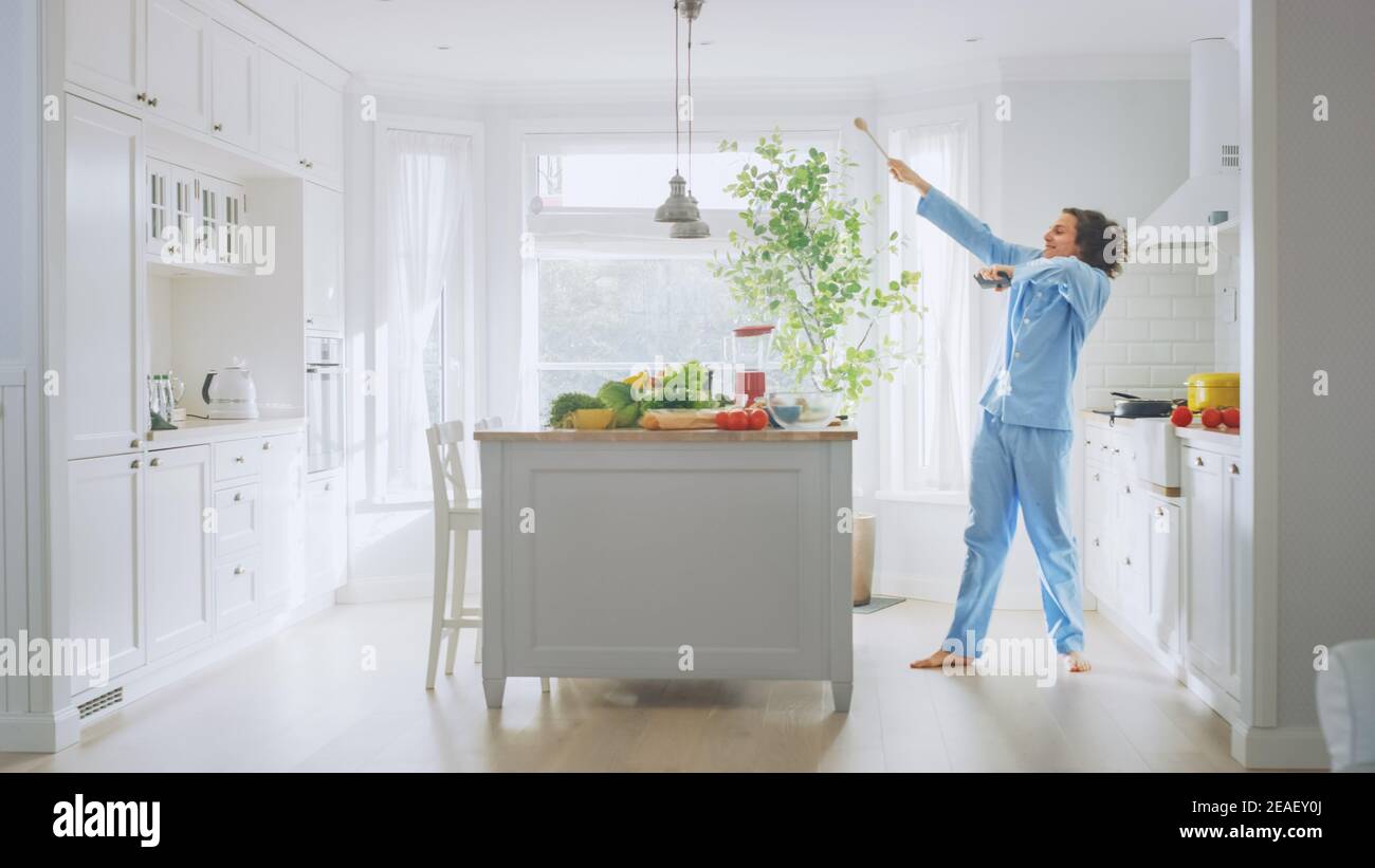 Crazy Funny Young Man with Long Hair Dancing in the Kitchen while ...