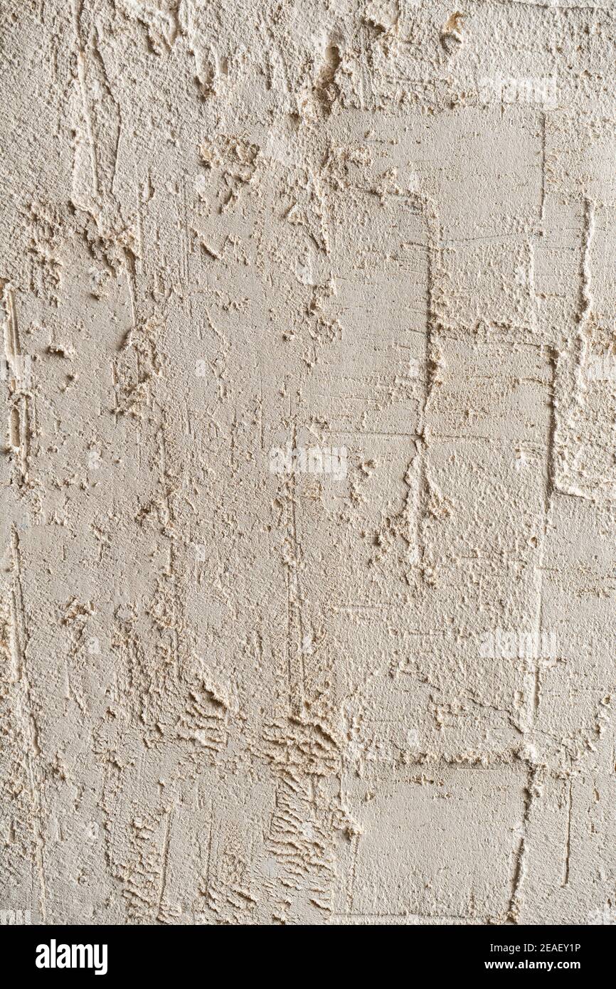 white textured plaster on the wall. Background for texture and design ...