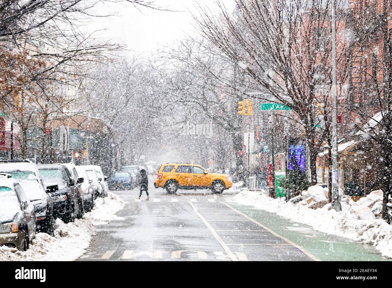 Snowy winter street scene at an intersection on 1st Avenue in the East ...