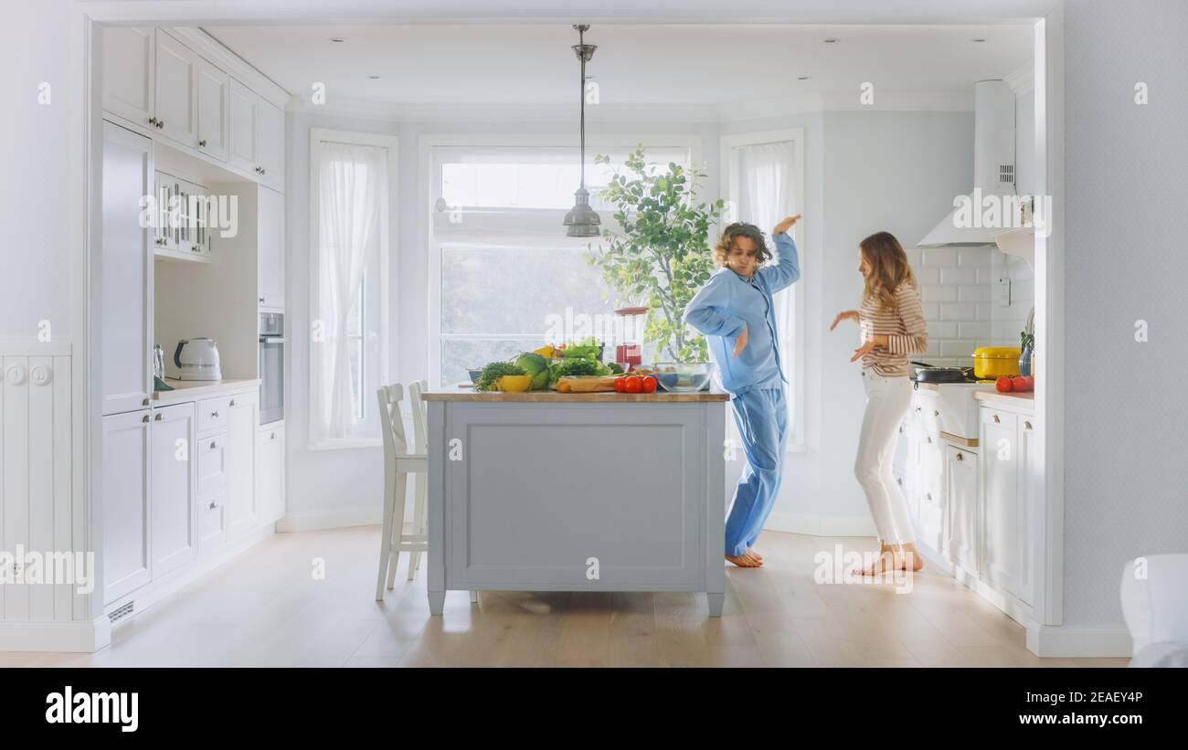 Handsome Young Man in Blue Pajamas and Beautiful Girl in Striped Jumper ...