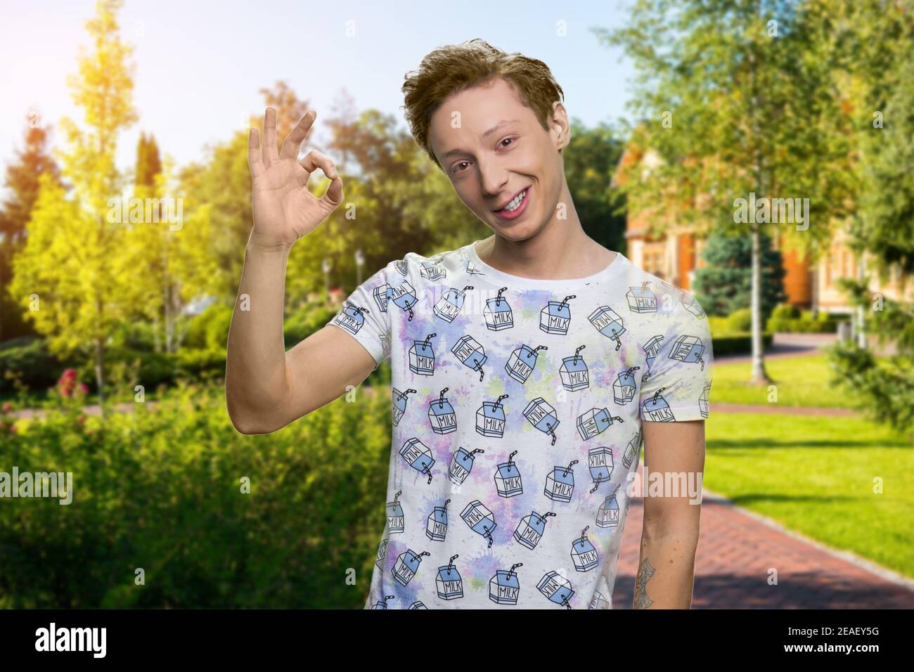 Teen boy shows ok gesture Stock Photo - Alamy