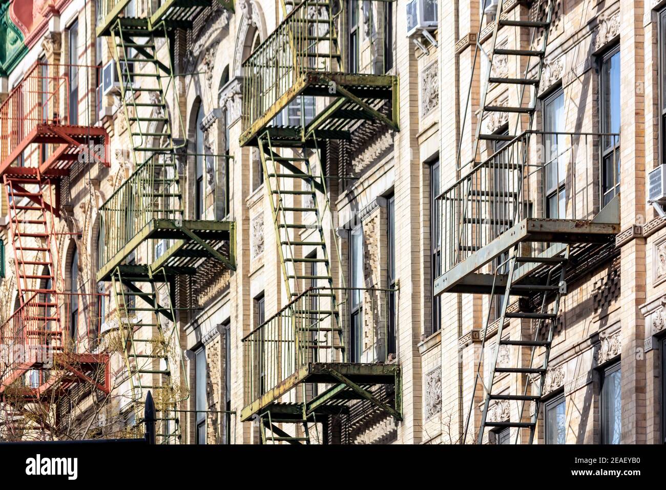 Old brick apartment buildings with colorful fire escapes in the East ...
