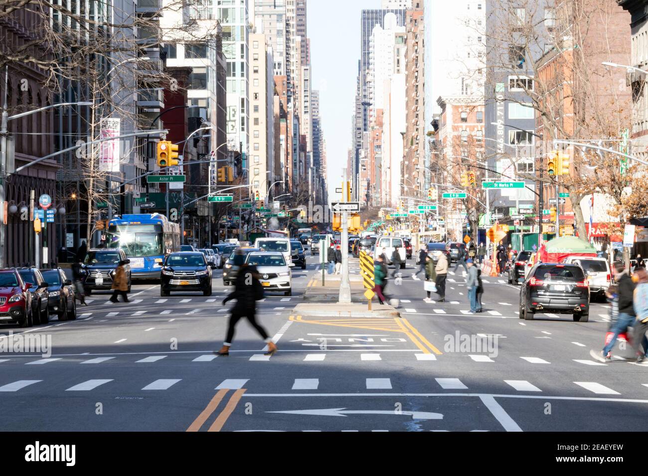 NEW YORK CITY - 2021: Busy street scene with crowds of people and cars ...