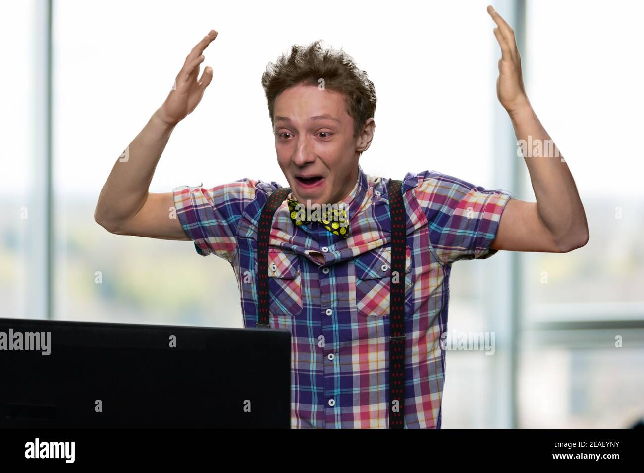 Excited boy is looking at the computer Stock Photo - Alamy