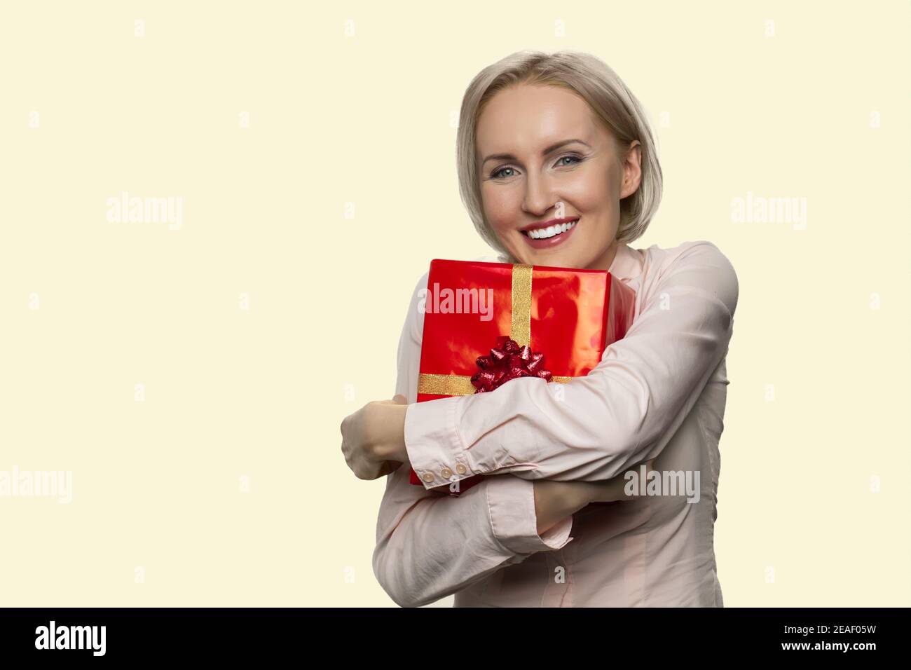 Woman hugging red box hi-res stock photography and images - Alamy