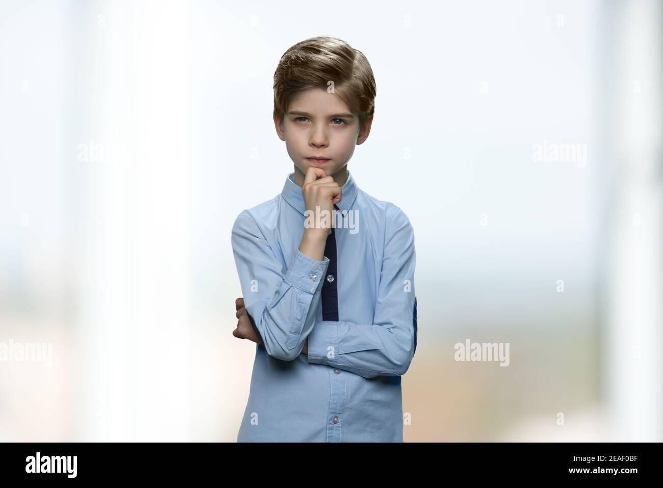 Portrait of thoughtful american little boy Stock Photo - Alamy