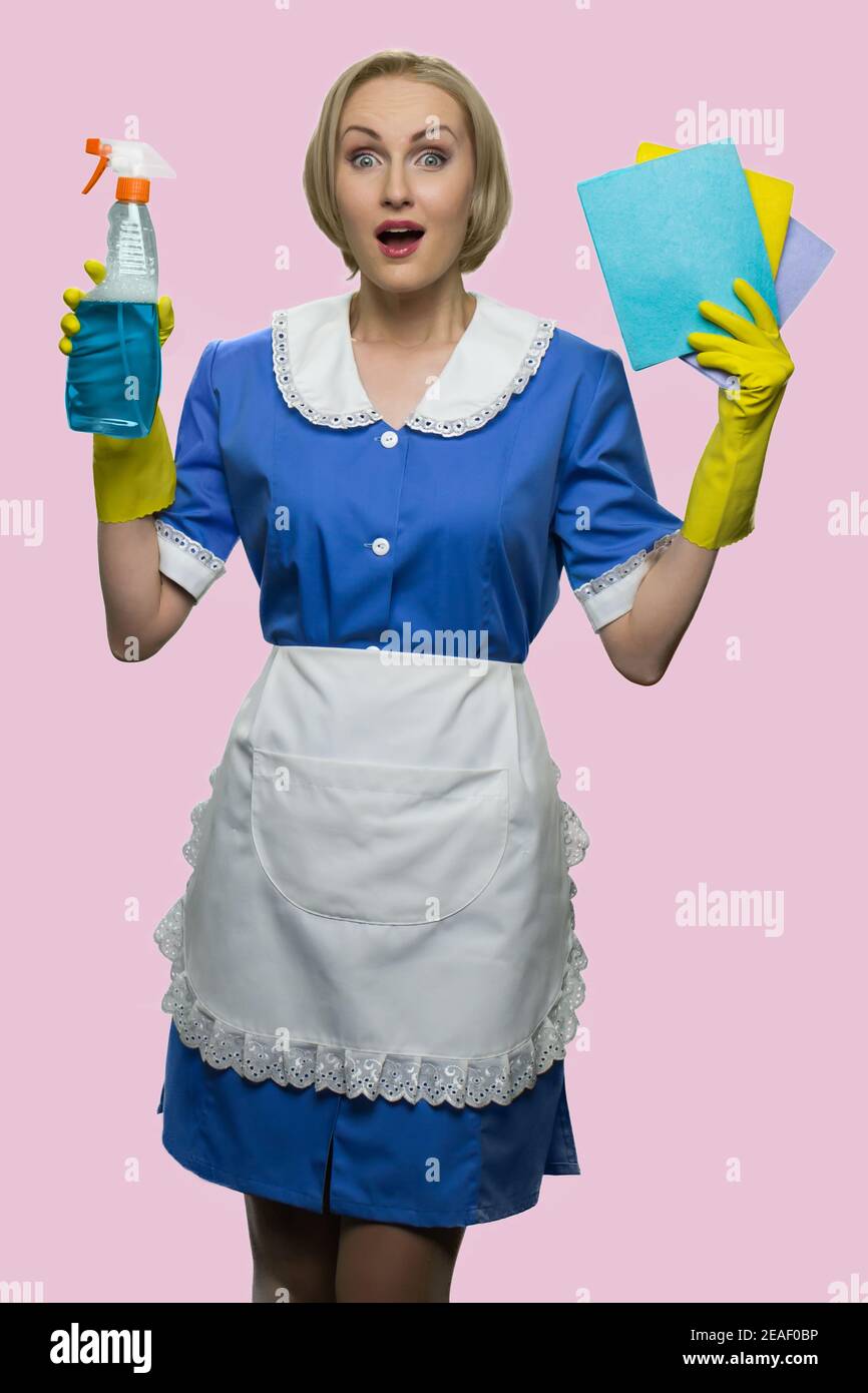 Full-sized portrait of surprised blonde housekeeper Stock Photo - Alamy