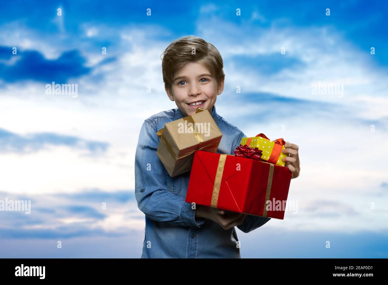 Child pile gifts hi-res stock photography and images - Alamy