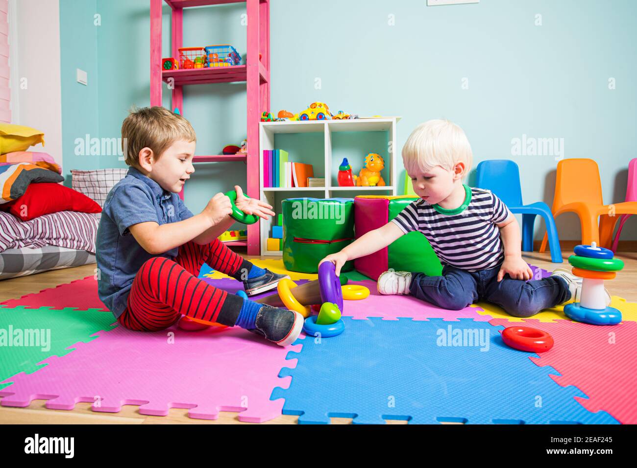 Kids learning to interact in the kindergarten Stock Photo - Alamy