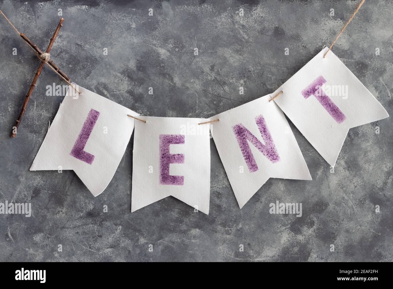 Lent word white cloth banner on dark background Stock Photo - Alamy