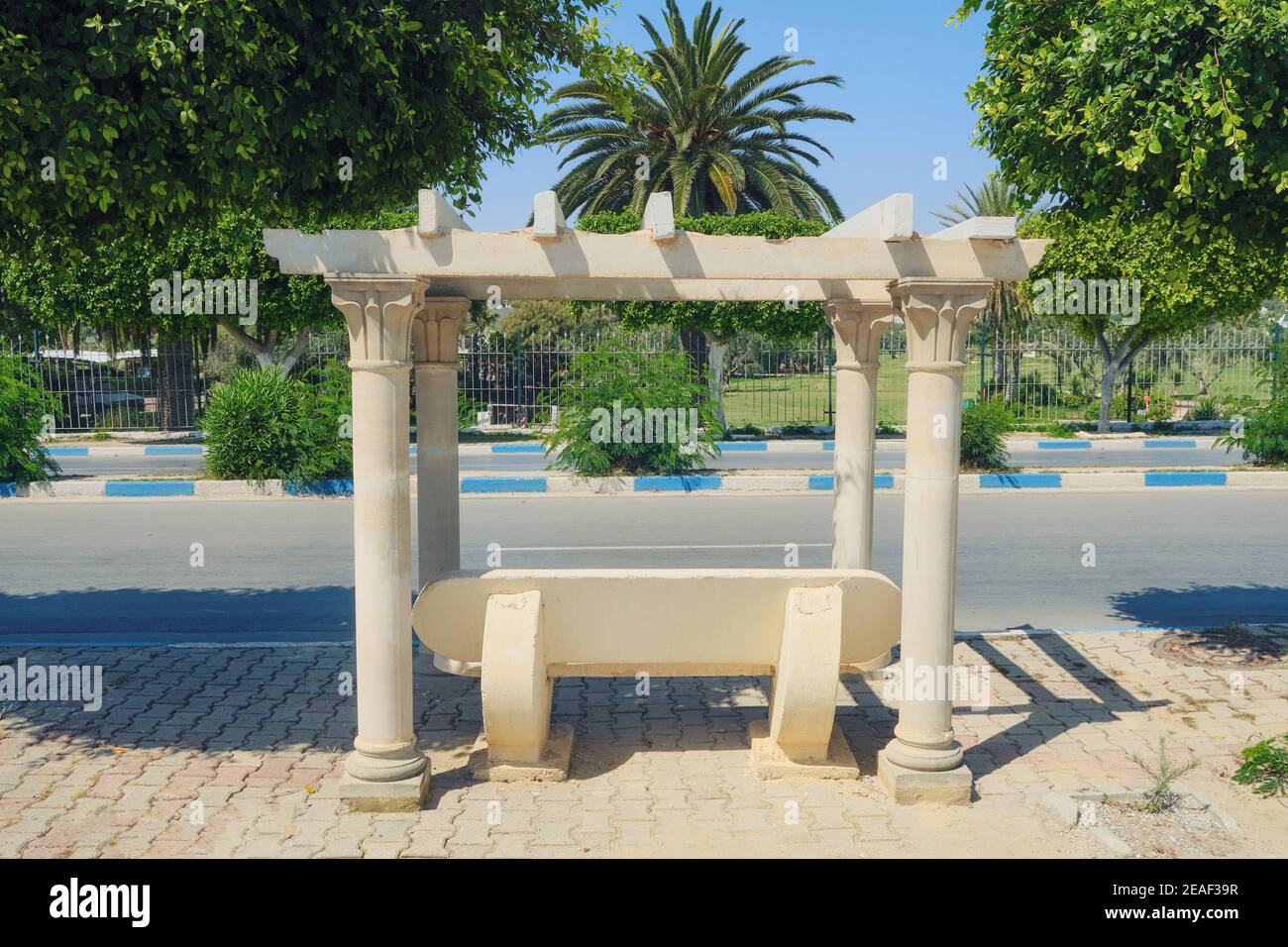 Empty bus stop with columns in the style of ancient Egypt Stock Photo ...