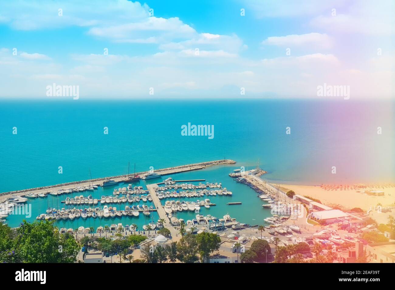 Sea bay, pier with yachts, clouds sky in Sidi Bou Said, background ...