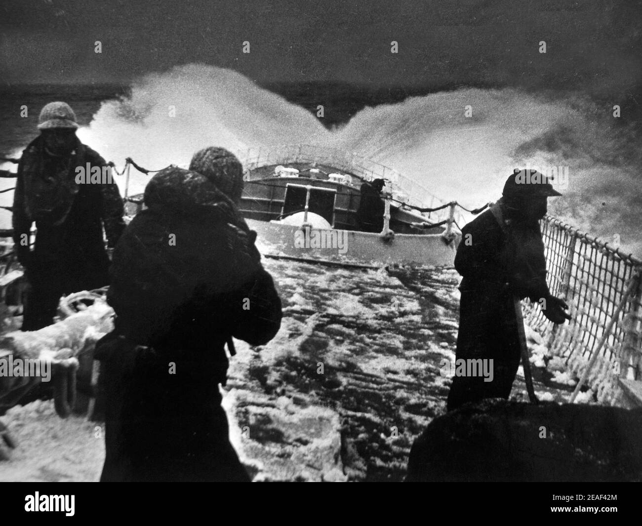CREW MEMBERS OF THE ROYAL NAVY FRIGATE HMS LEANDER CLEAR THE DECK OF ...