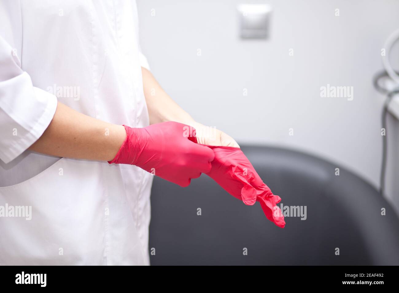woman female doctor wears red medical gloves on a hands Stock Photo - Alamy