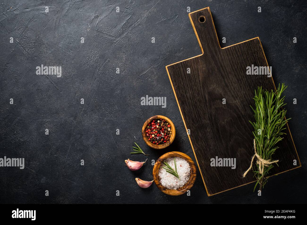 Food cooking background with herbs and spices on black Stock Photo - Alamy