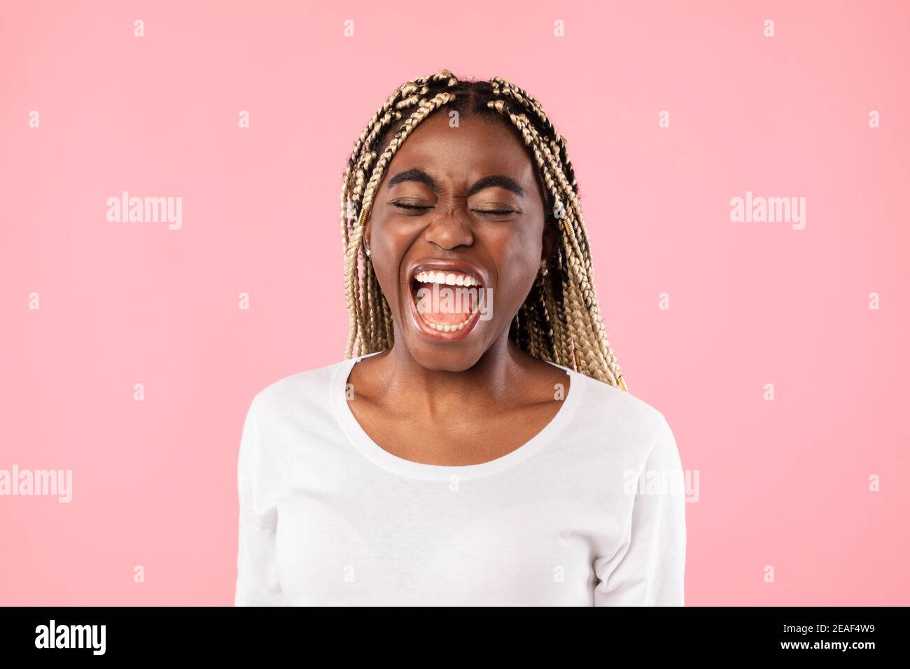 Portrait of young emotional african american woman screaming Stock ...