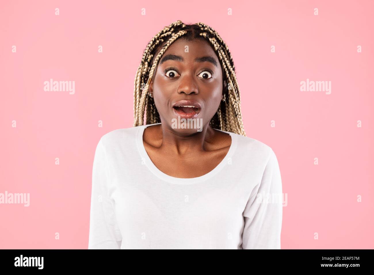 Surprised young african american woman staring at camera Stock Photo - Alamy