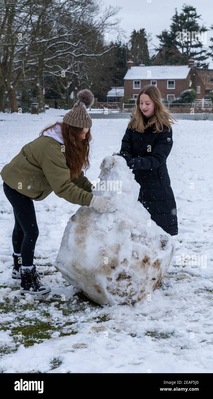 Girls making snowman hi-res stock photography and images - Alamy