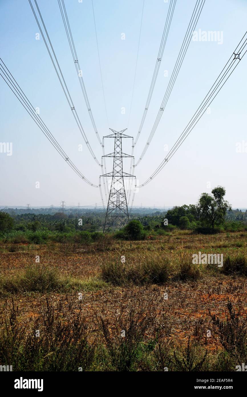 High voltage transmission towers line Stock Photo - Alamy