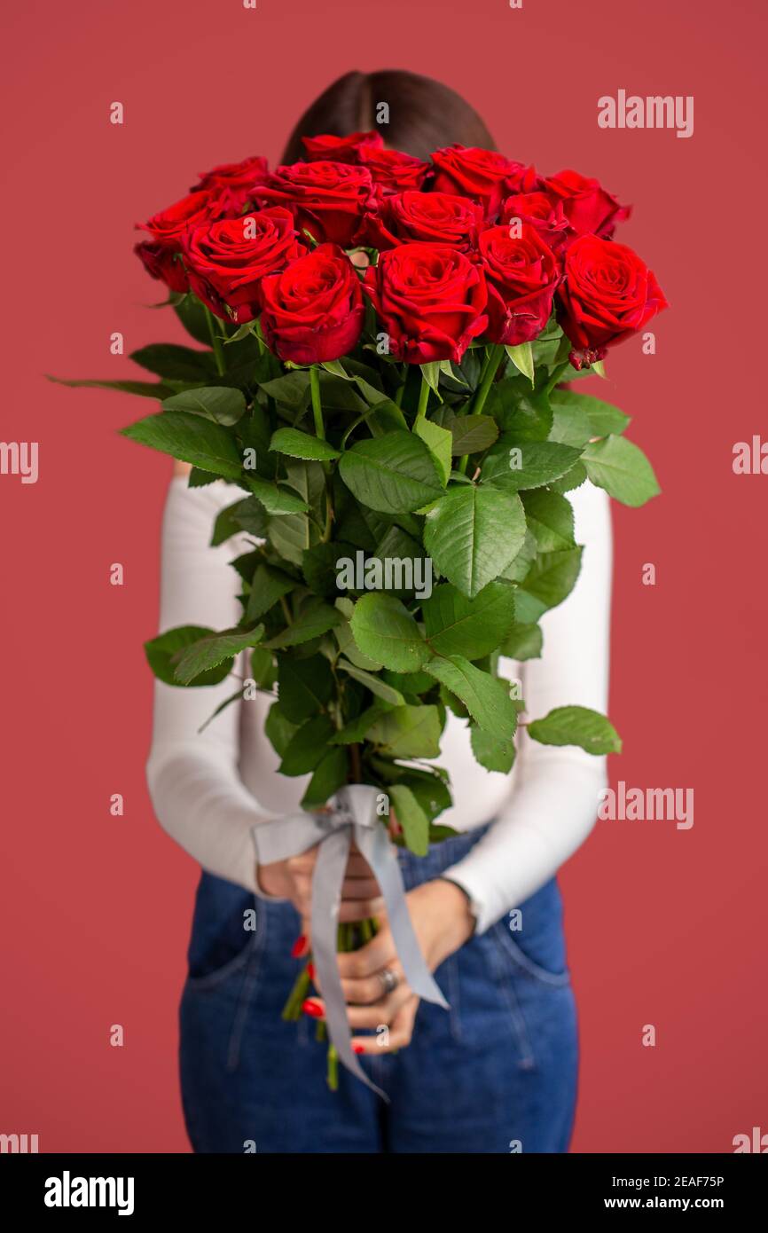 The girl with big bouquet of flower roses Stock Photo - Alamy