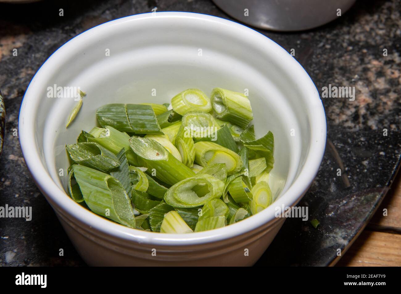 Cut spring onion in a bowl ready to be used as cooking ingredients ...