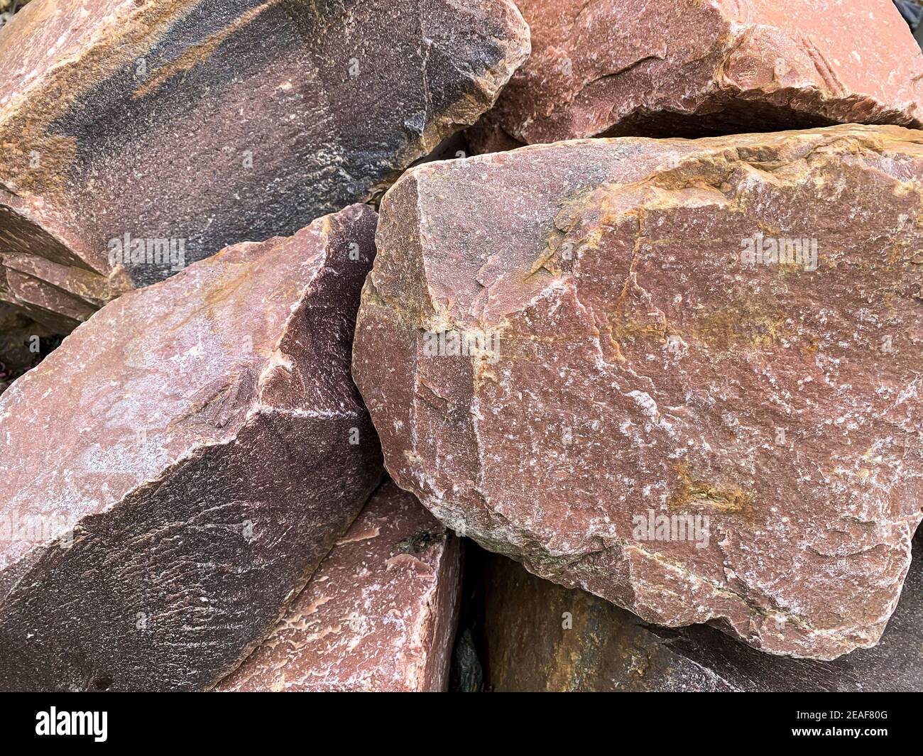 Background from multi-colored stones of different shapes Stock Photo ...