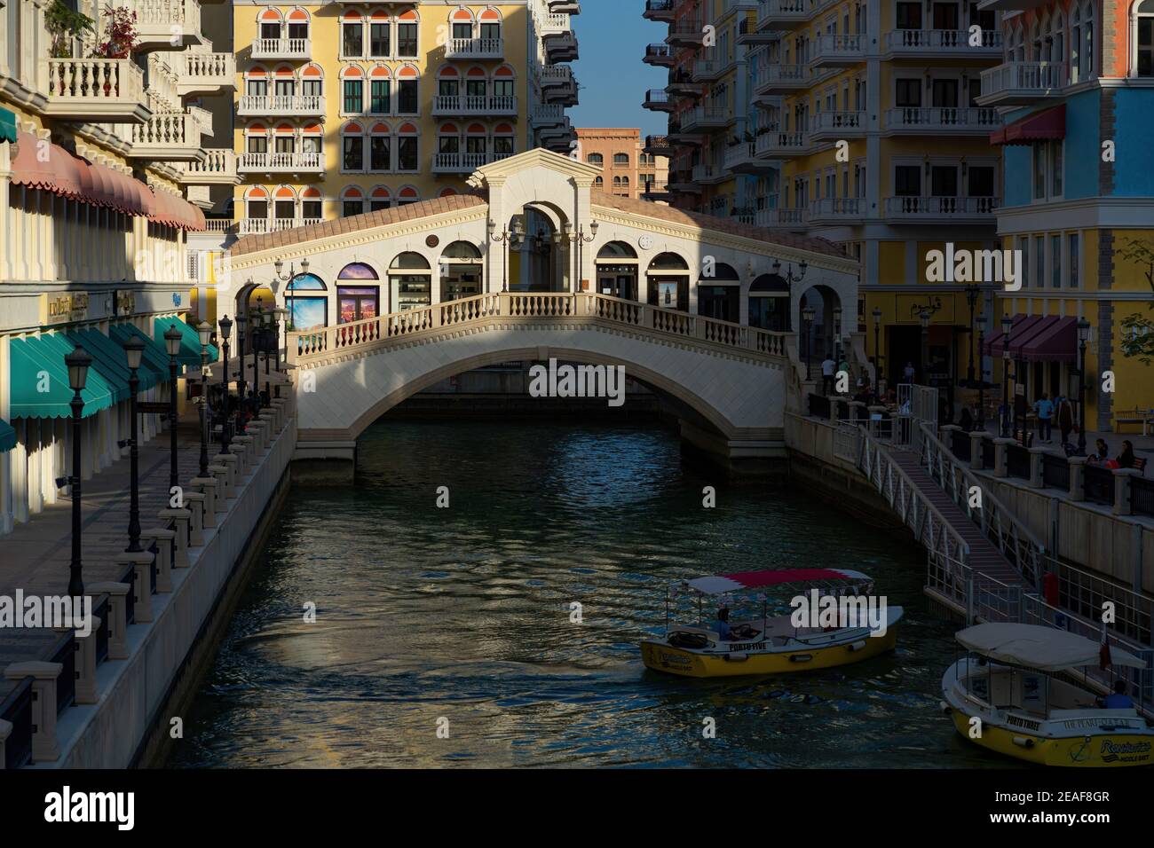 Qanat Quartier precinct in The Pearl, Doha, with pastel-colored low ...