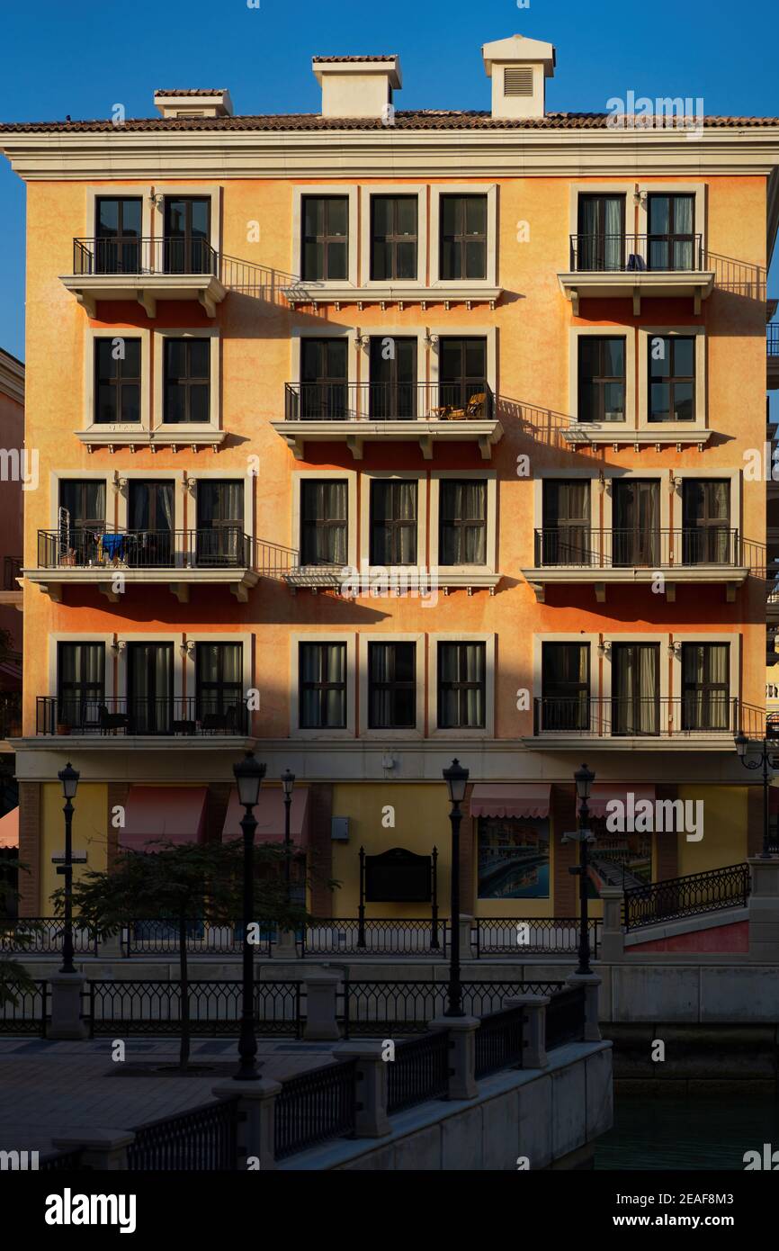 Qanat Quartier precinct in The Pearl, Doha, with pastel-colored low ...